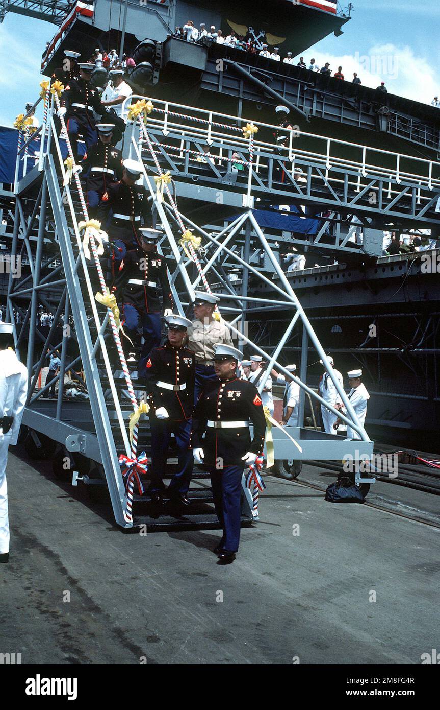 Members of the Marine detachment assigned to the aircraft carrier USS ...