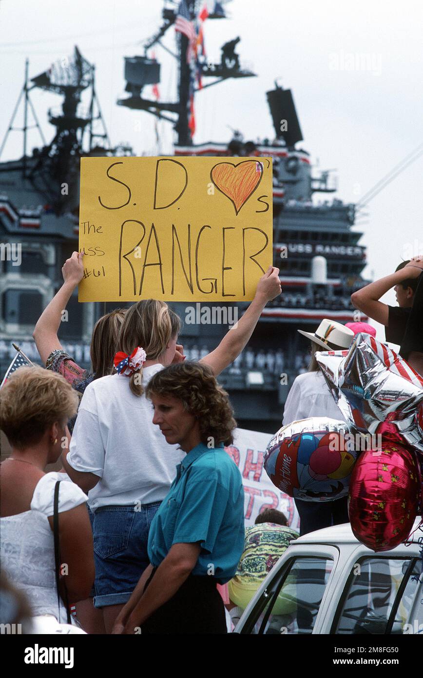 A sign expresses the sentiments of one crowd member upon the return of ...