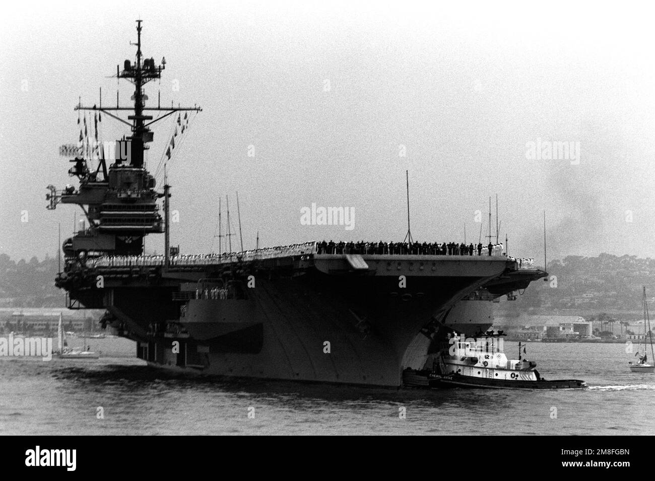 With its crew manning the rails, the aircraft carrier USS RANGER (CV-61 ...