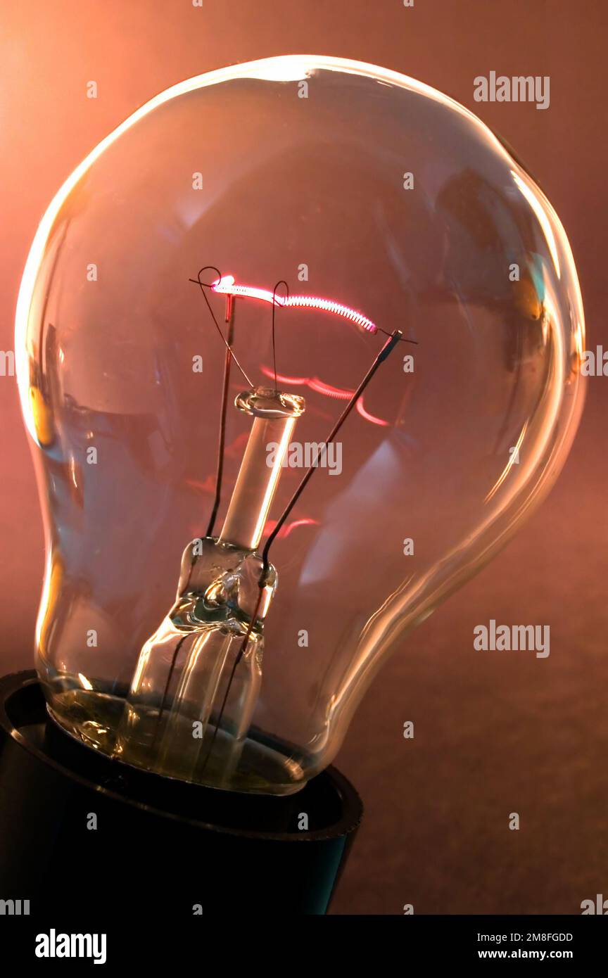 A lamp bulb and a fluorescent tungsten spiral showing the presence of ...