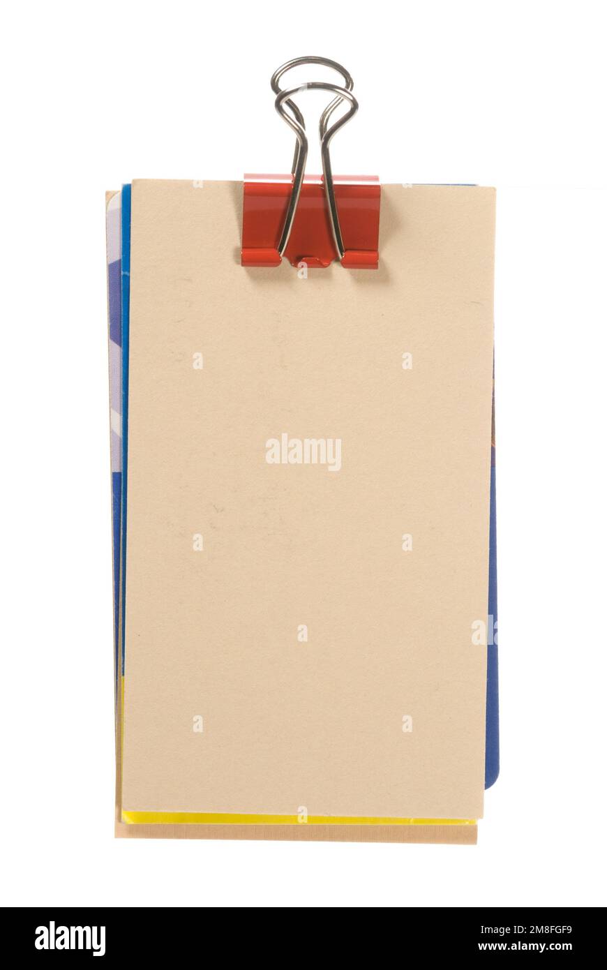 A bundle of paper with a clip isolated on white Stock Photo - Alamy