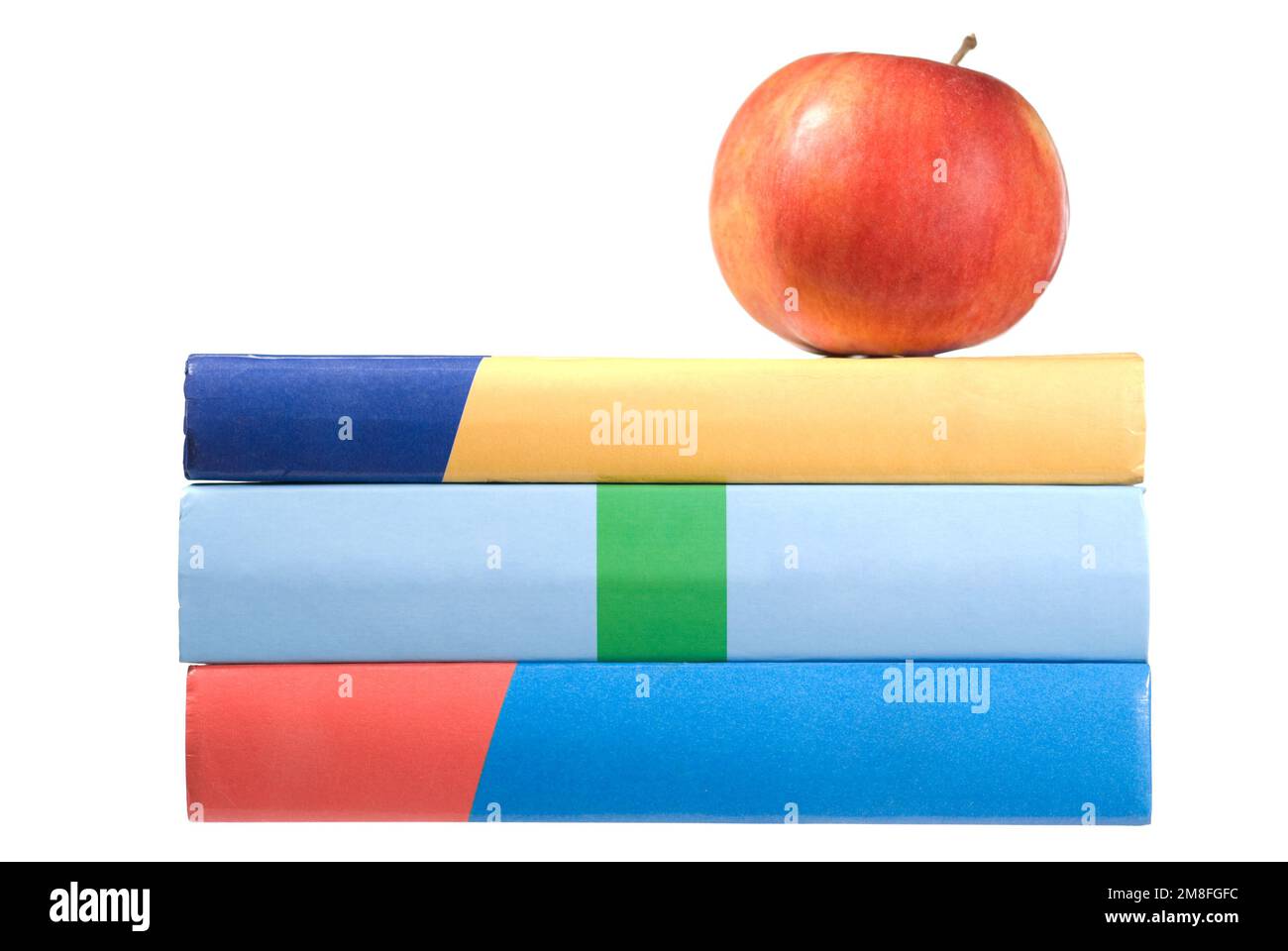 A stack of books with apple on white Stock Photo - Alamy