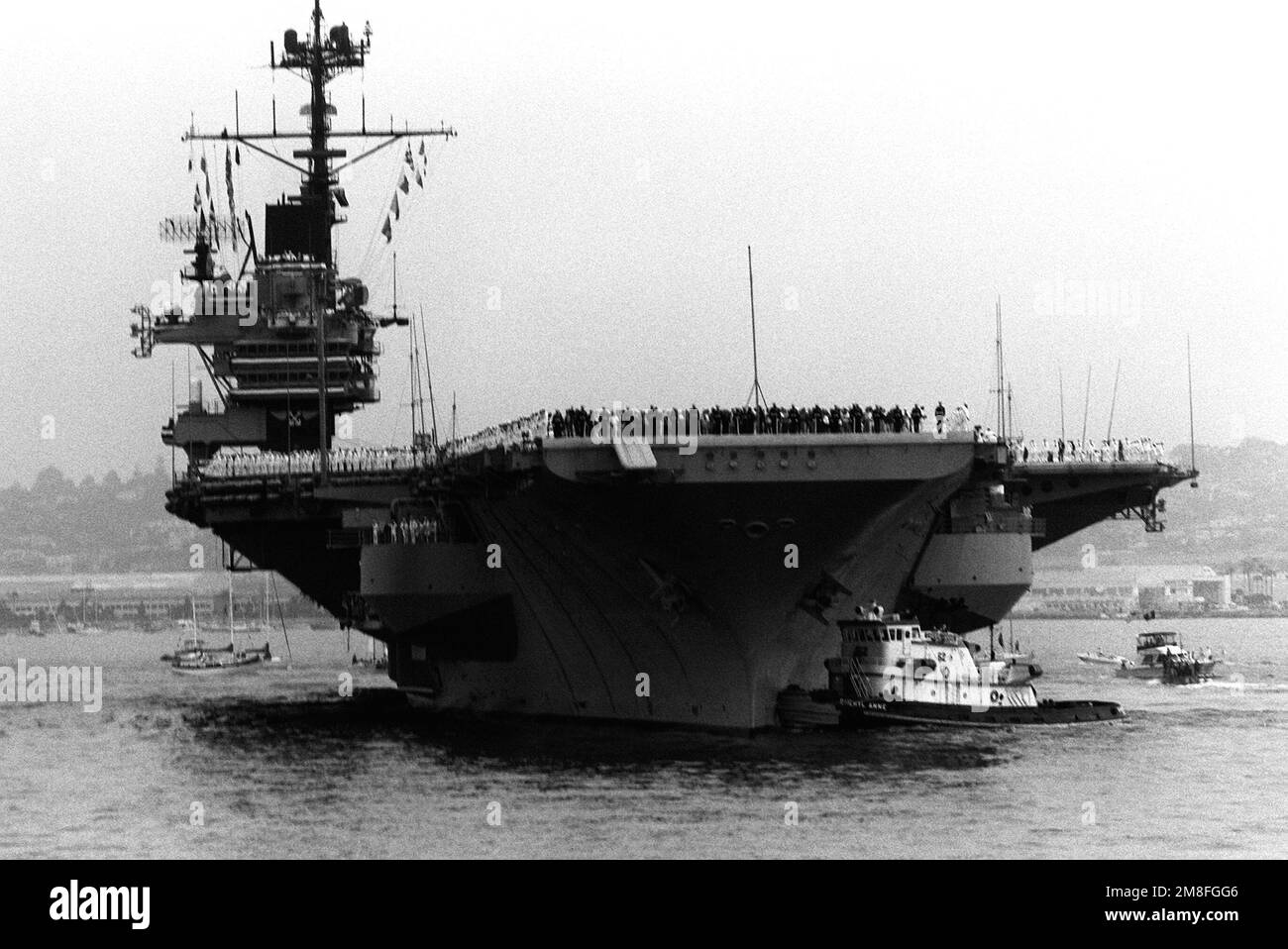 With its crew manning the rails, the aircraft carrier USS RANGER (CV-61 ...