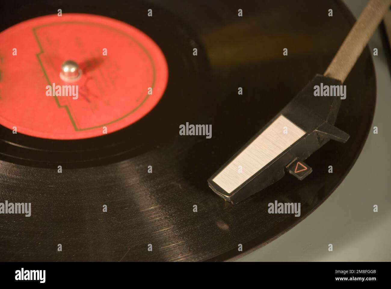 An old scratched gramophone record with a tone-arm Stock Photo - Alamy