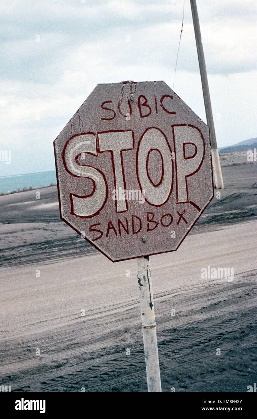 An ash-covered stop sign describes the surrounding area in the ...