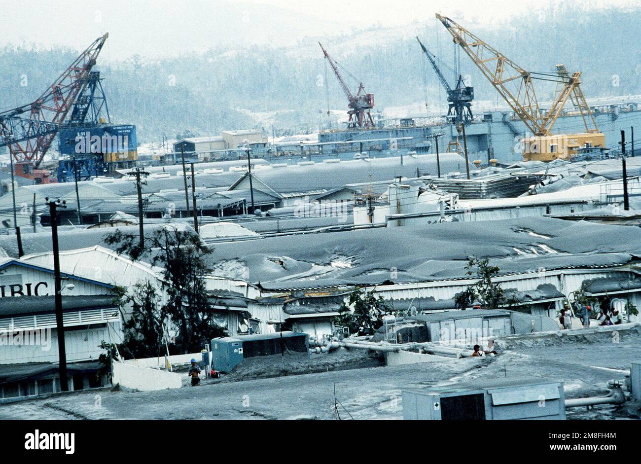 Buildings collapse under the weight of volcanic ash and typhoon rains ...