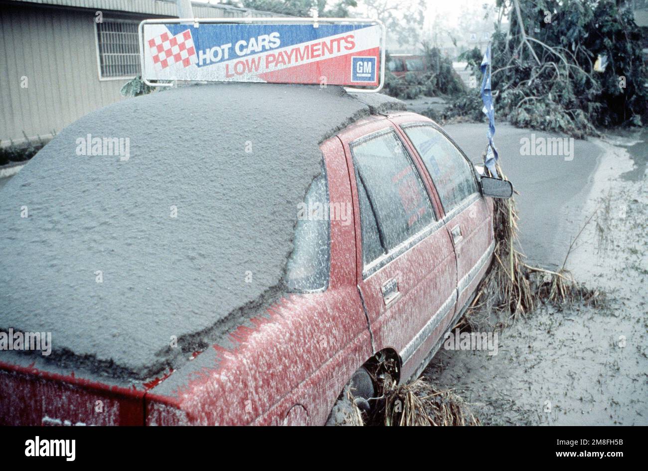 Ash covers a vehicle following the eruption of Mount Pinatubo, a ...