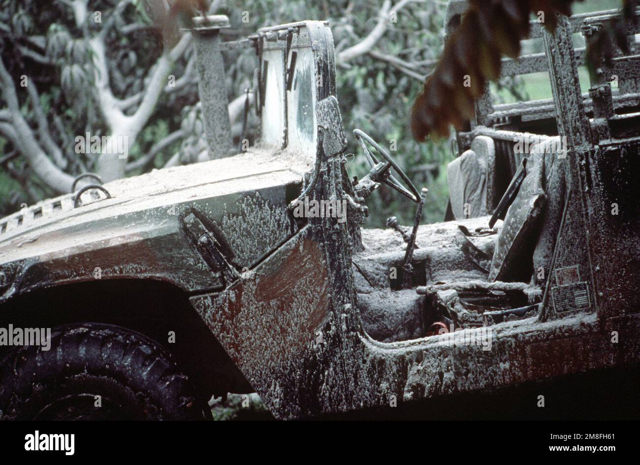 Ash covers an M998 High-Mobility Multipurpose Wheeled Vehicle (HMMWV ...
