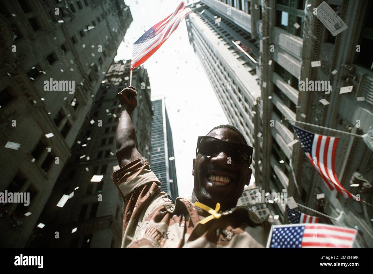 U.S. Army Private First Class White waves an American flag while the ...