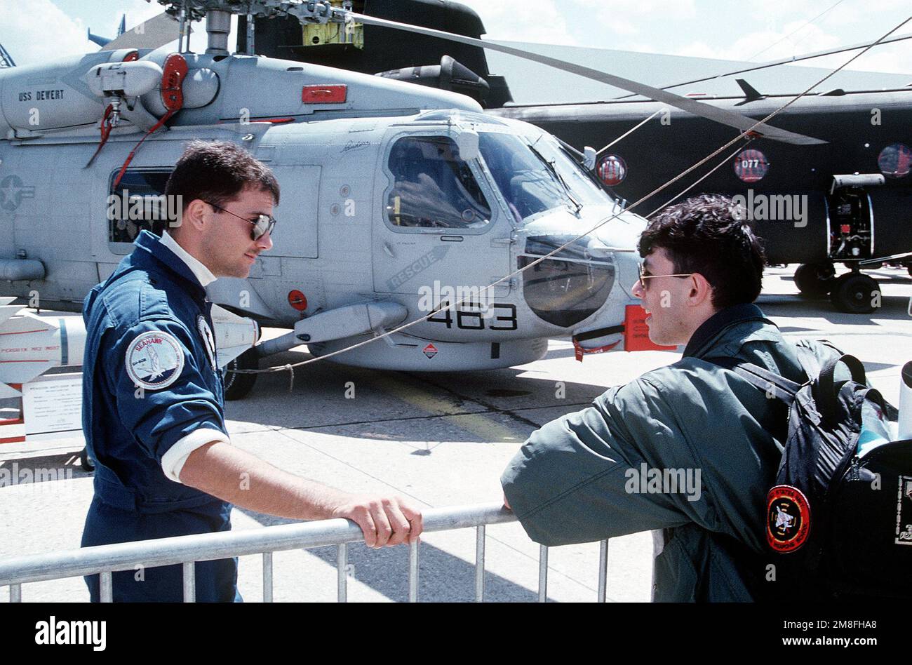 A member of Light Helicopter Anti-submarine Squadron 46 (HSL-46) talks ...