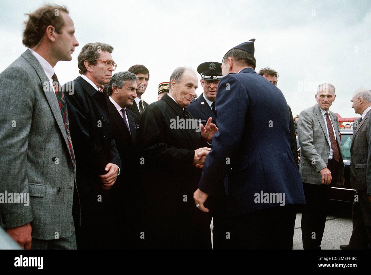 A U.S. Air Force general greets French President Francois Mitterrand as ...