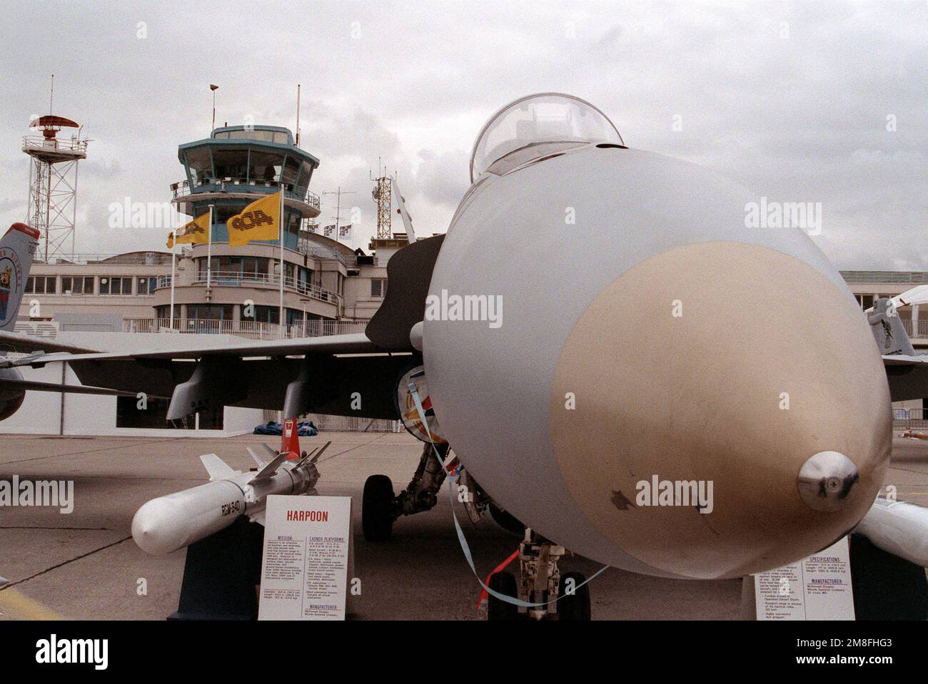 An RGM-84D Harpoon anti-ship missile sits on a pedestal beside a Strike ...