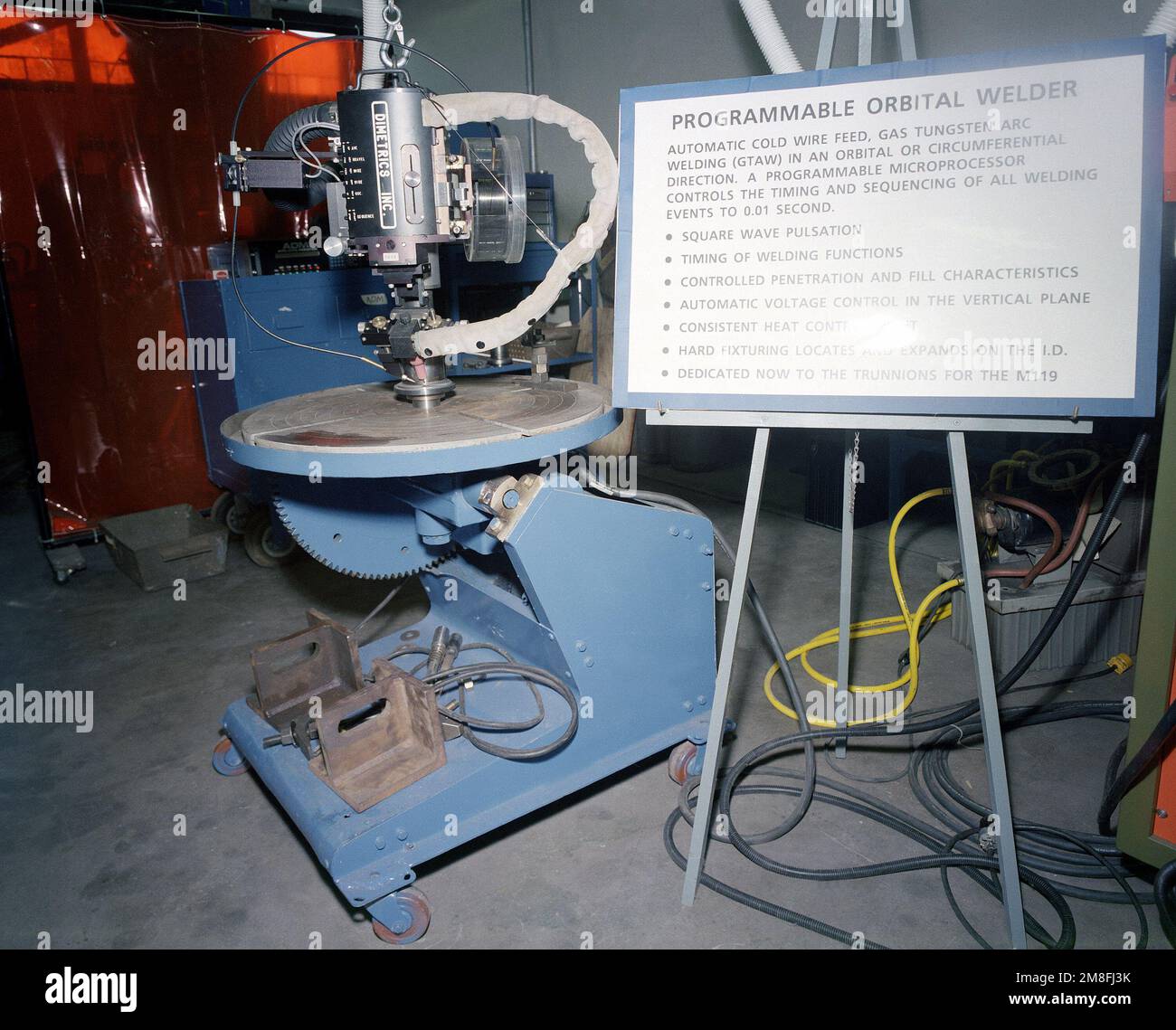 A placard describes the programmable orbital welder, currently being ...