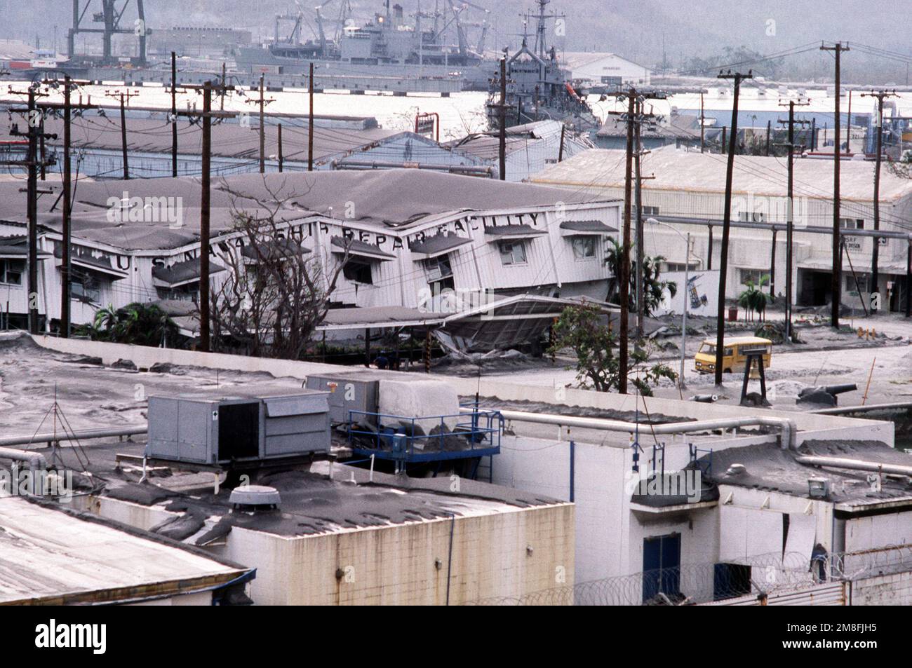 The roof of the Ship Repair Facility is collapsed under the weight of ...