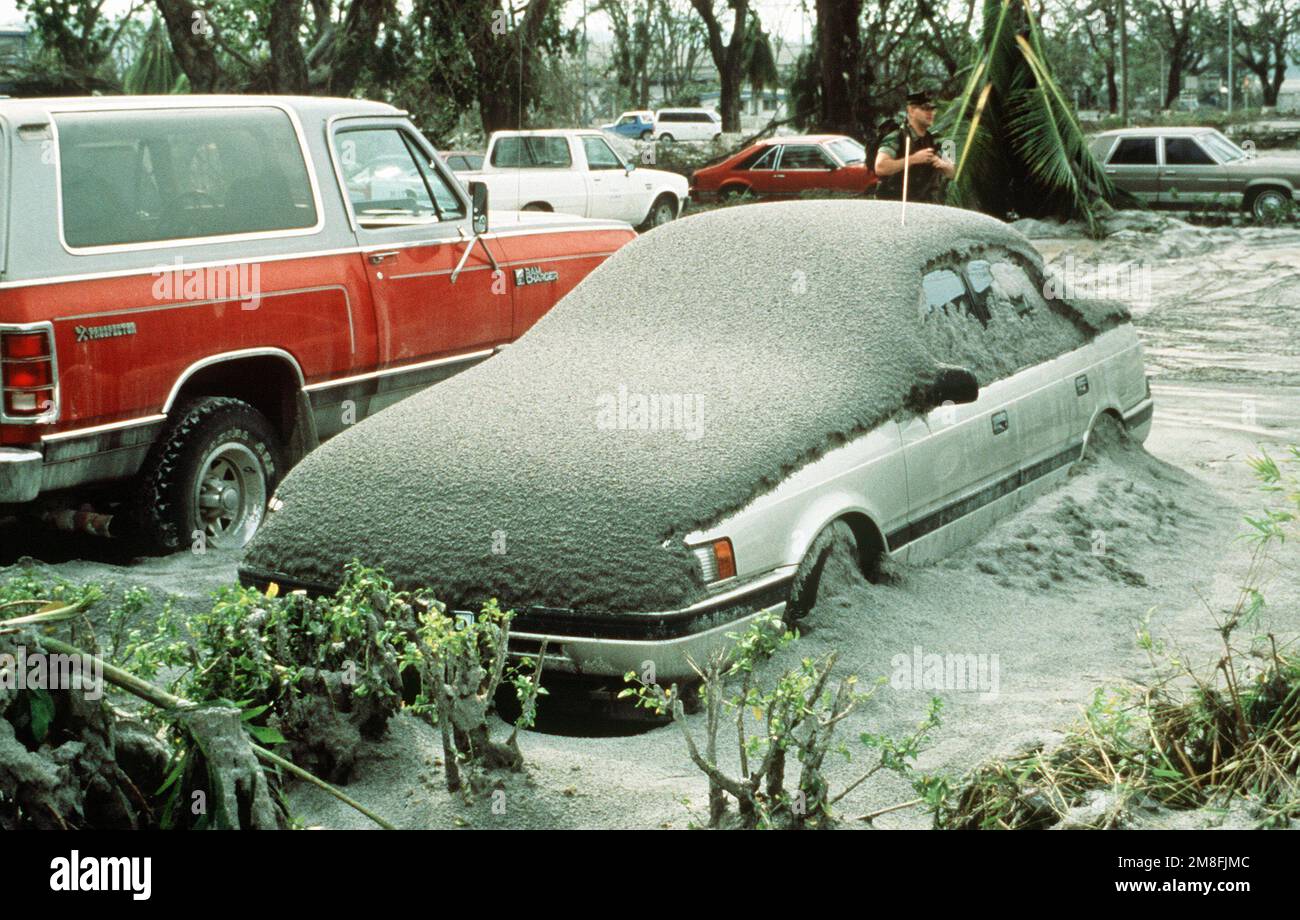 Ash covers a vehicle following the eruption of Mount Pinatubo, a ...