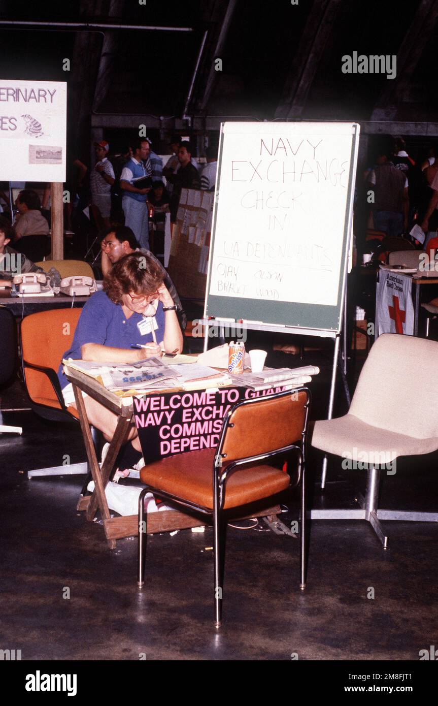 A woman talks on the Navy commissary telephone help line to get ...