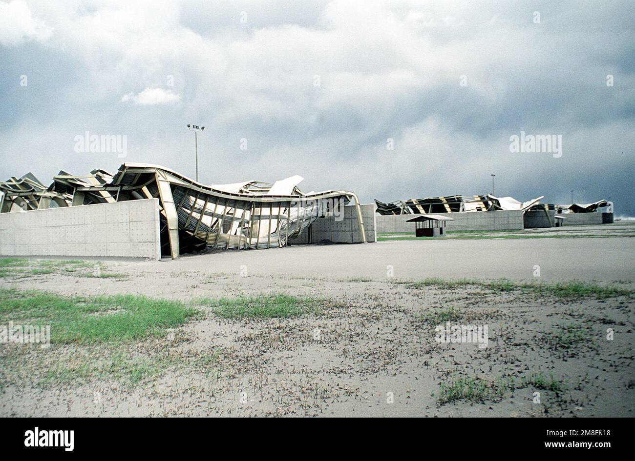 A view of several aircraft weather shelters that collapsed under the ...