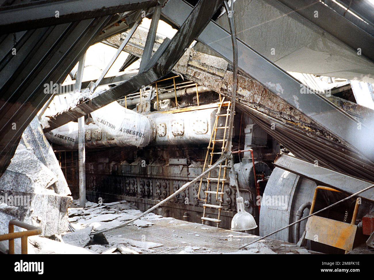 Generating equipment lies beneath a section of collapsed roof in the ...