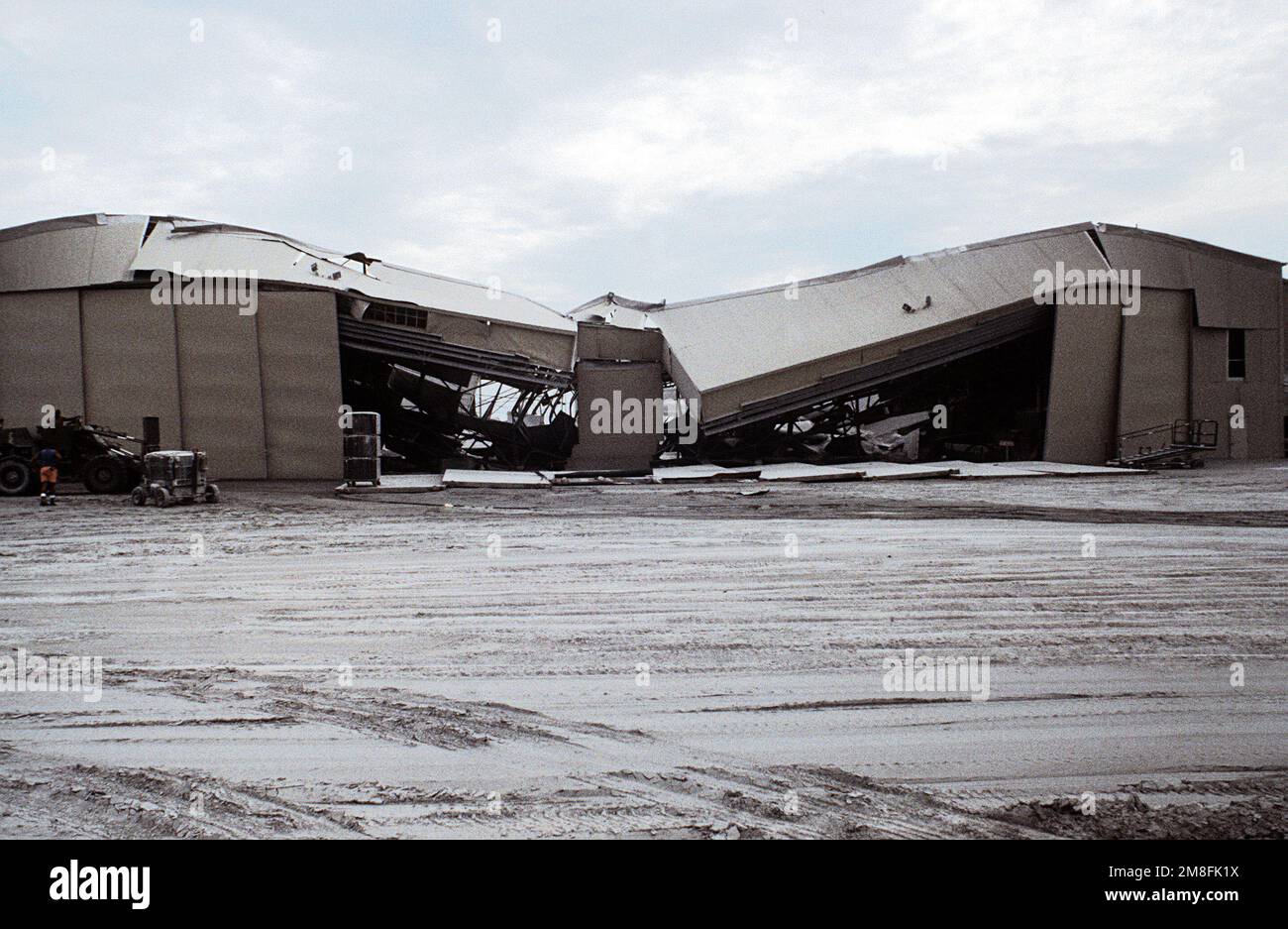 A view of an aircraft maintenance facility that collapsed under the ...