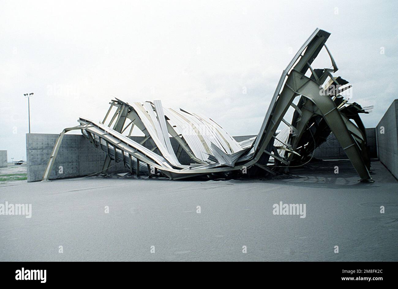 A view of an aircraft weather shelter that collapsed under the weight ...