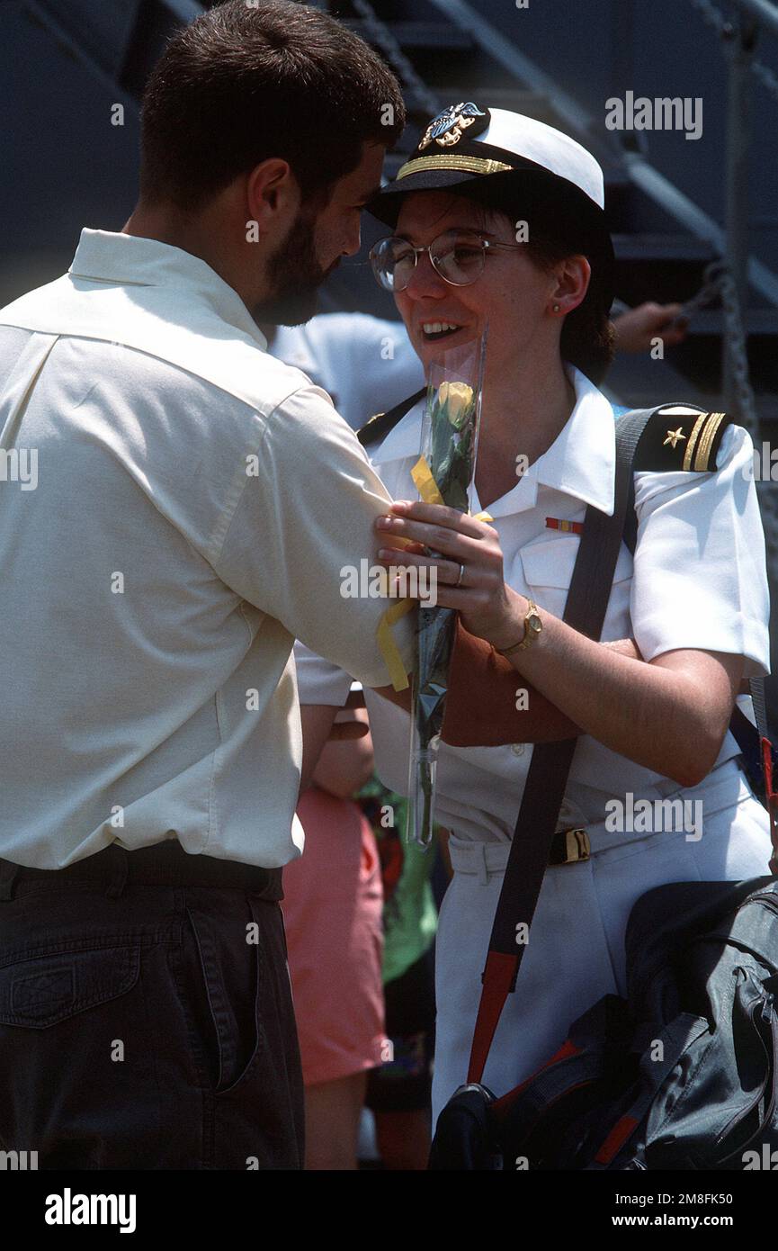 An officer is reunited with her husband following her arrival in ...