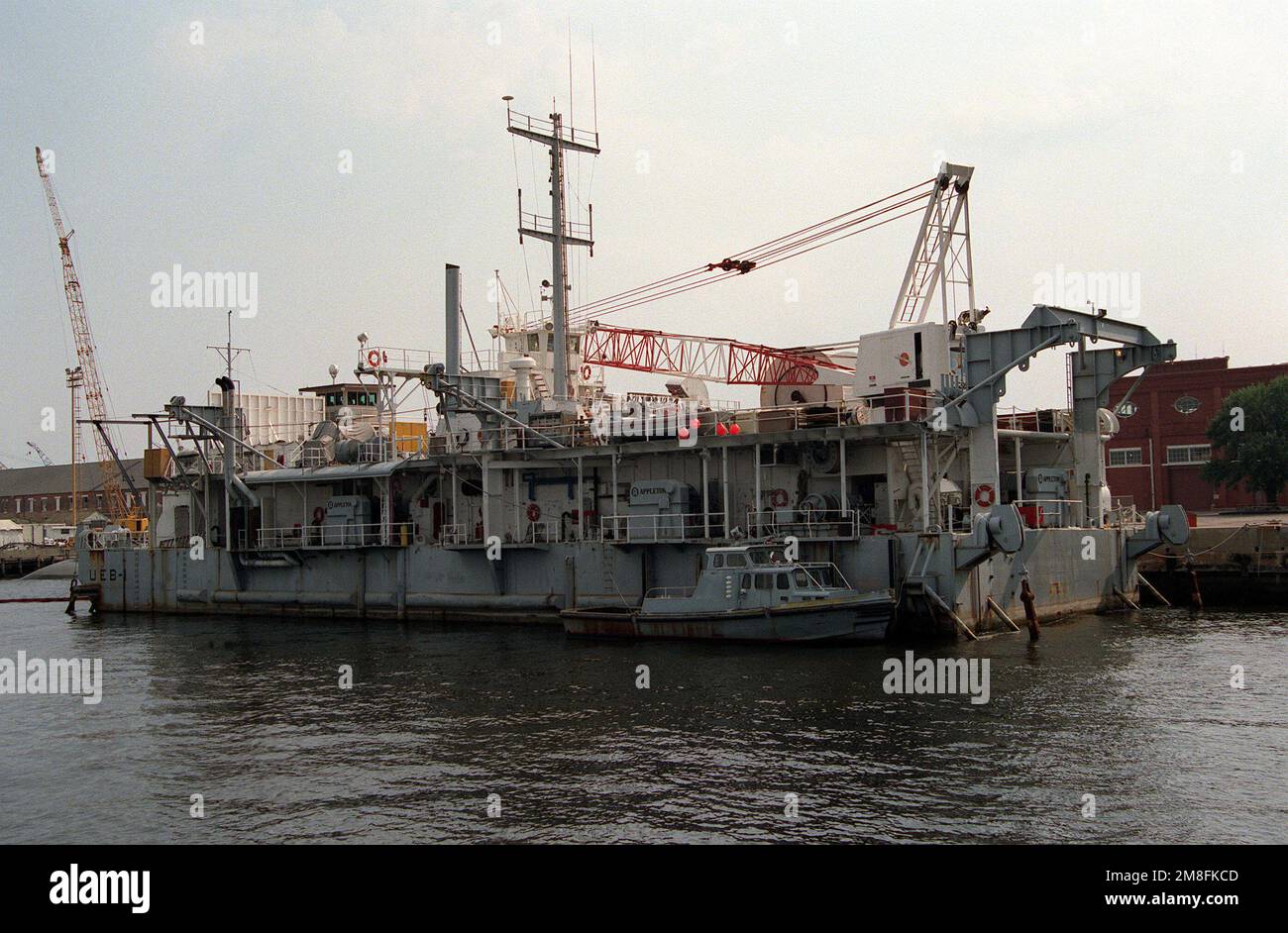 A view of underwater explosive barge 1 (UEB-1) tied up at the Norfolk ...