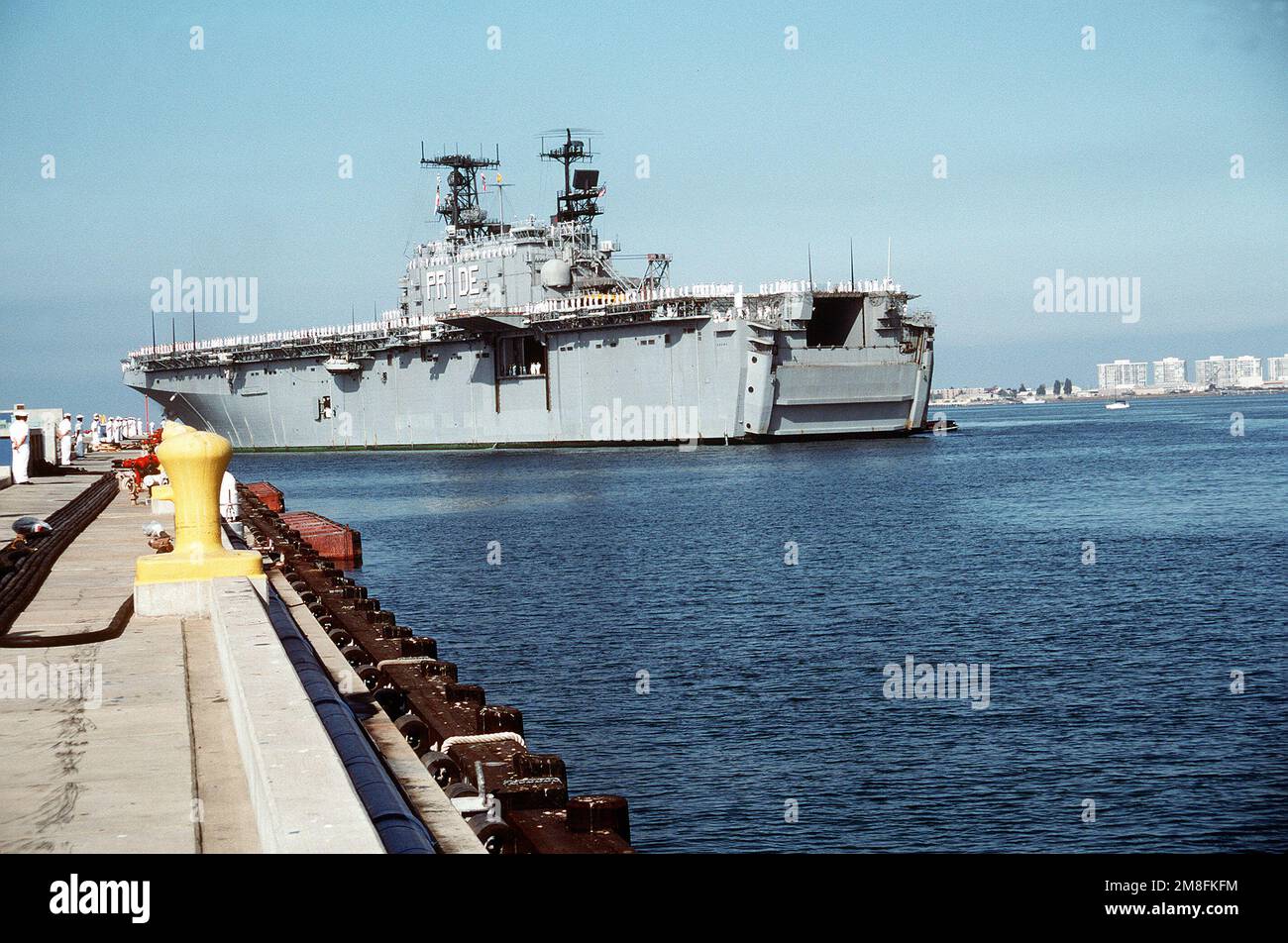The amphibious assault ship USS TARAWA (LHA-1) is moved into its berth ...