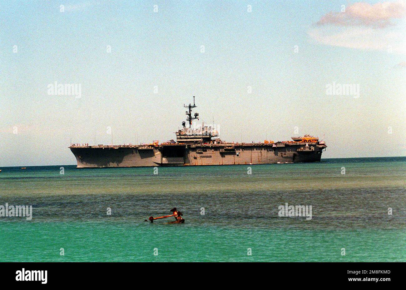 The amphibious assault ship USS TRIPOLI (LPH-10) heads toward the open ...