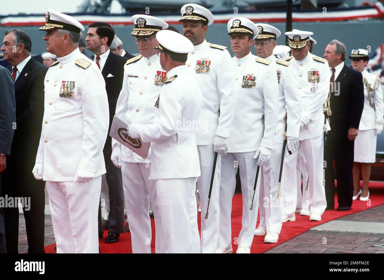 Admirals and other guests stand to leave the platform following the ...