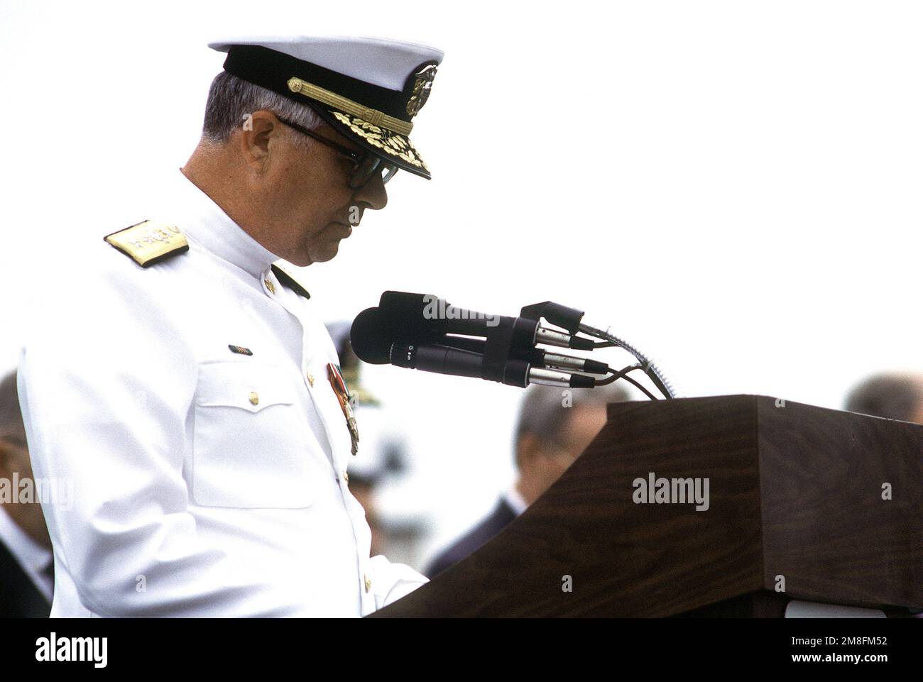 RADM Alvin B. Koeneman, the Navy's chief of chaplains, reads the ...
