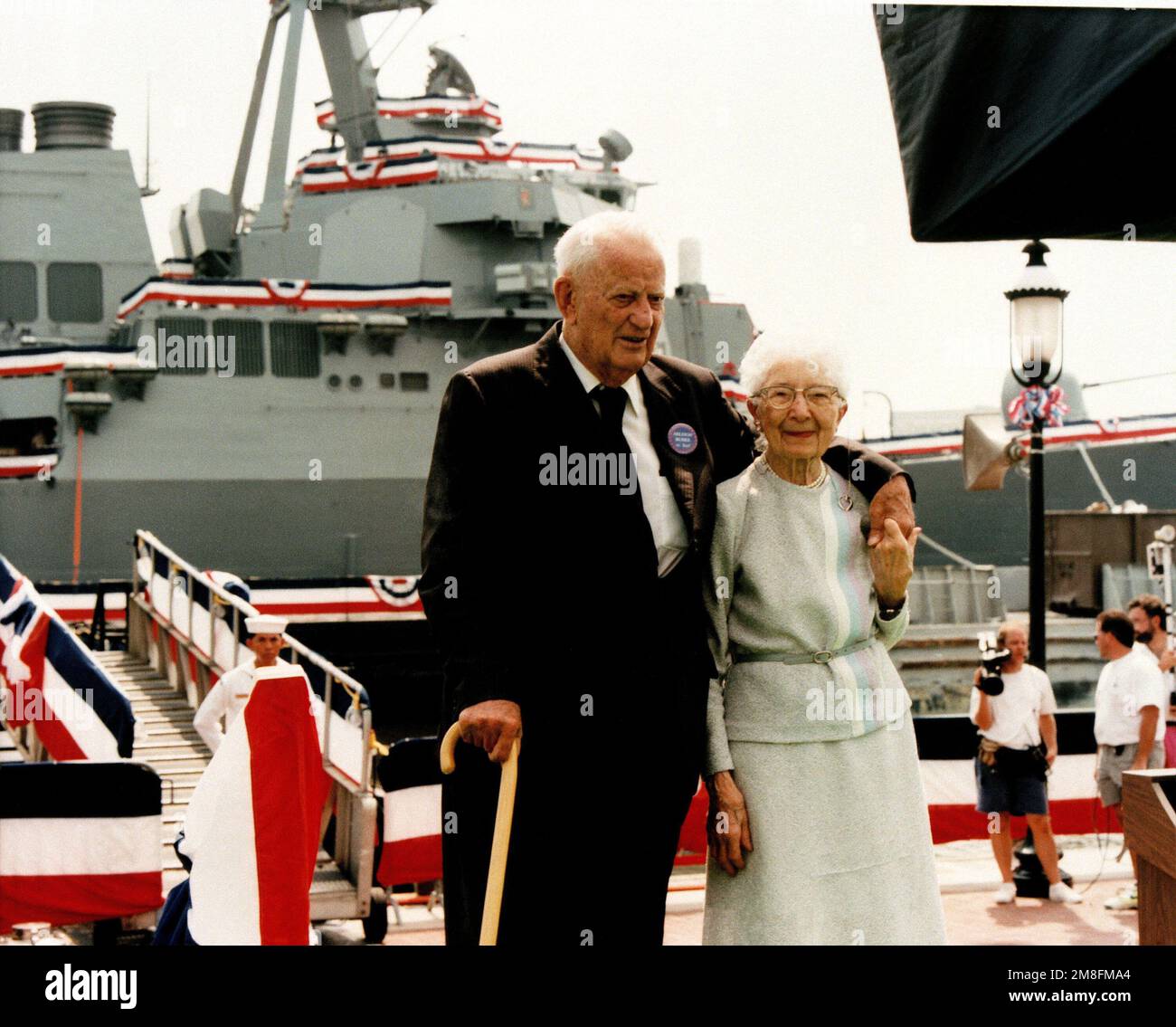Retired ADM Arleigh Burke and his wife, Roberta, stand on the pier in ...