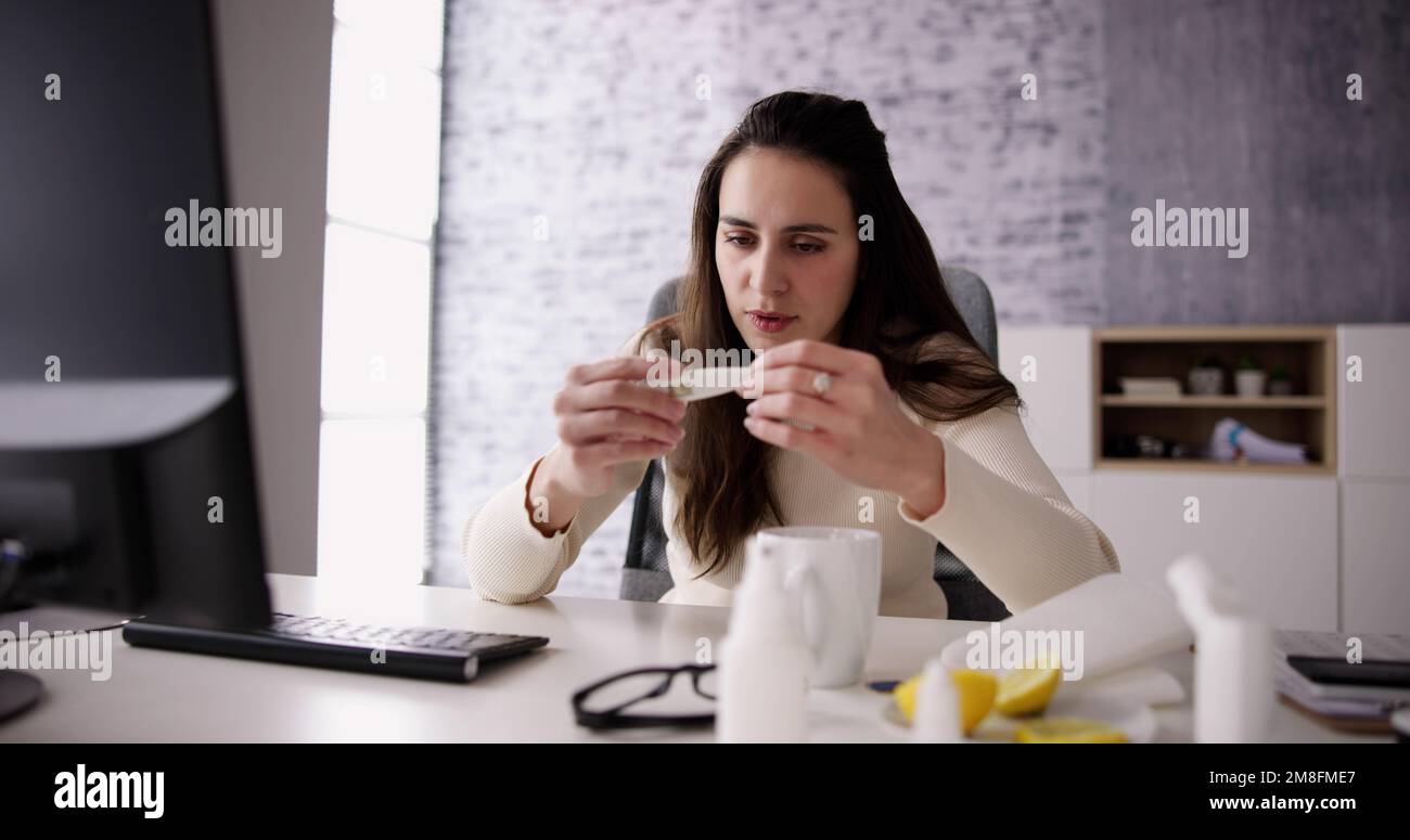 Sick Office Worker With Flu. Employee At Desk With Cold Stock Photo - Alamy