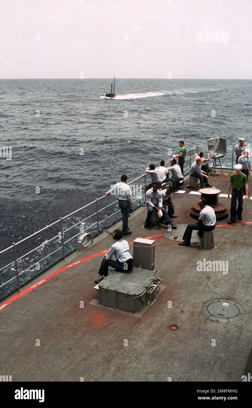 The nuclear-powered attack submarine USS SAND LANCE (SSN 660) surfaces ...
