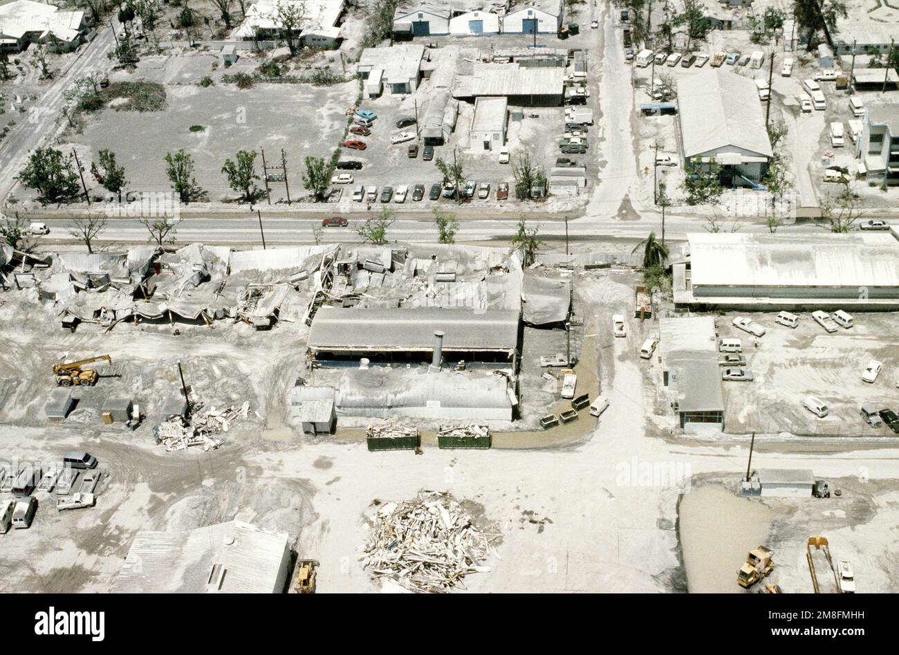 The roofs of buildings collapse under the weight of ash from the ...