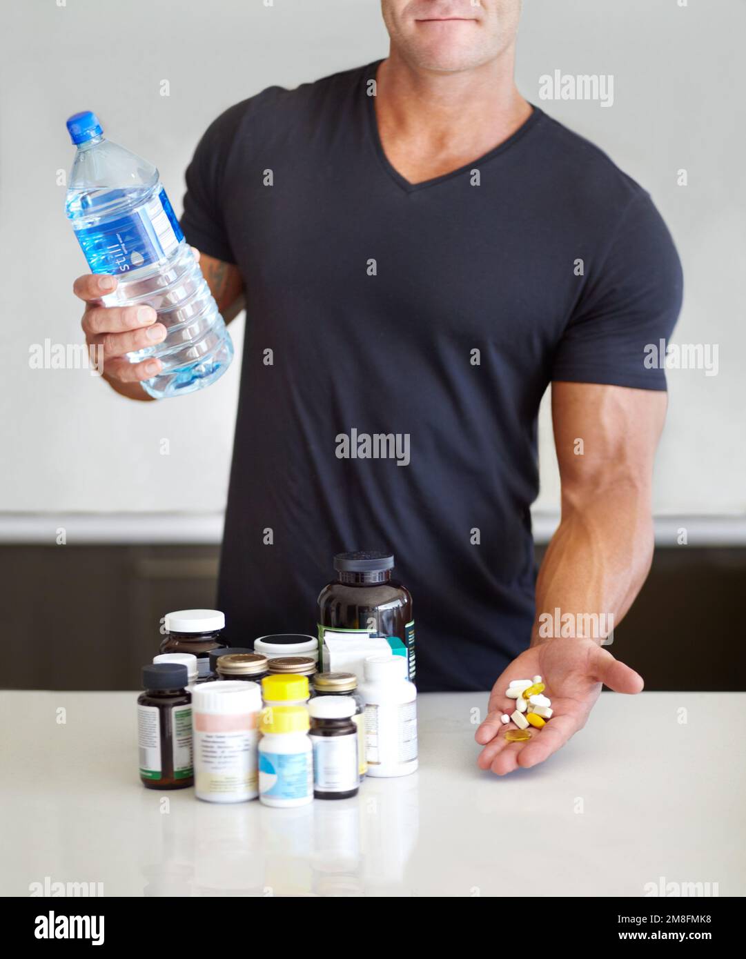 Man holding pill muscular hi-res stock photography and images - Alamy