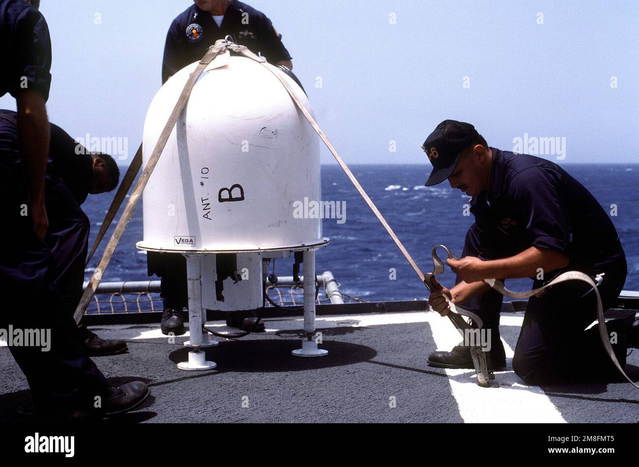 Members of Fleet Composite Squadron 6 (VC-6) secure a guidance radar to ...