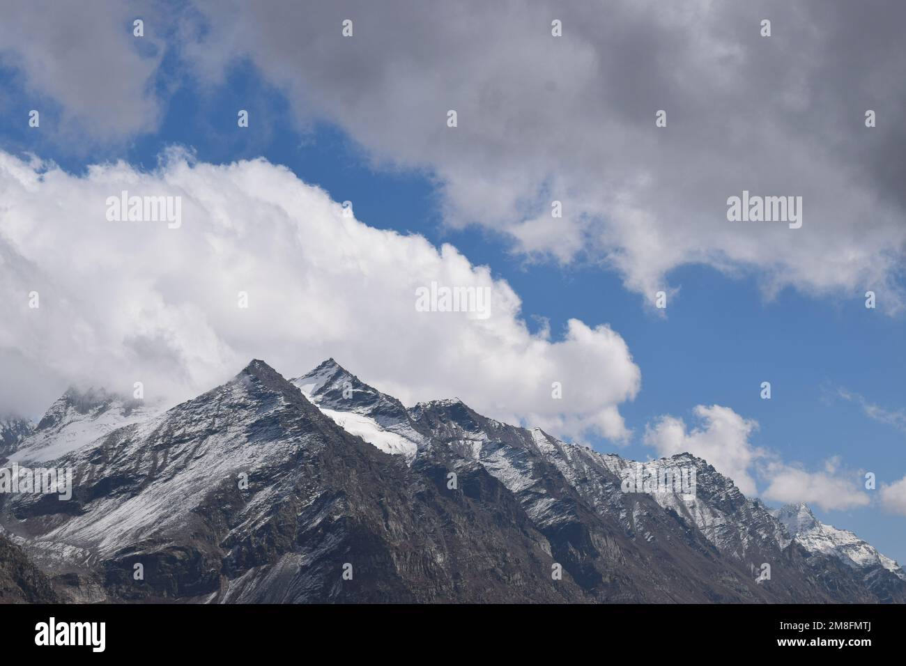 A landscape scene of snowy range mountains in Himachal Pradesh, India ...