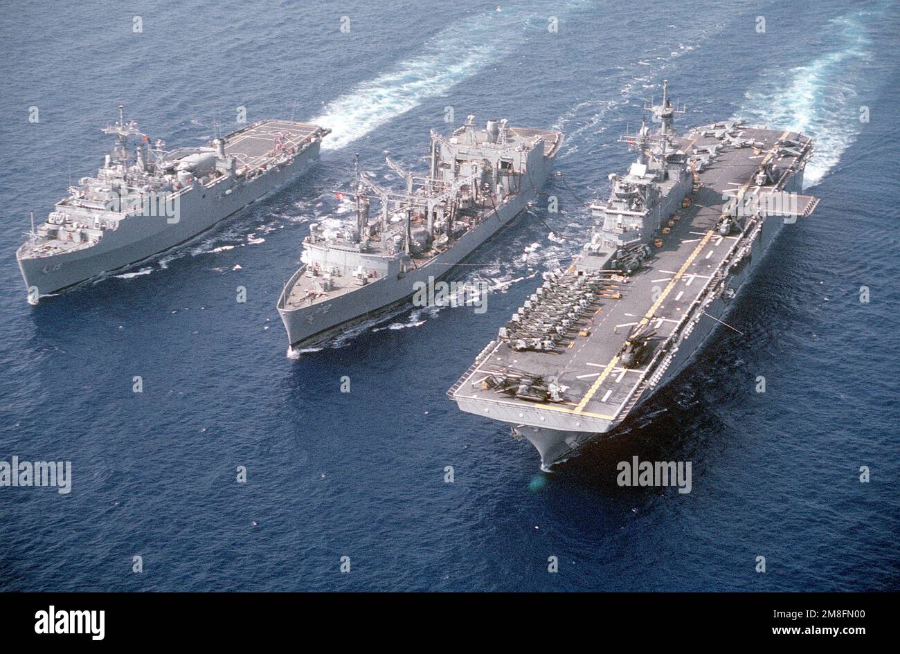 The amphibious transport dock USS PONCE (LPD 15), left, comes alongside ...
