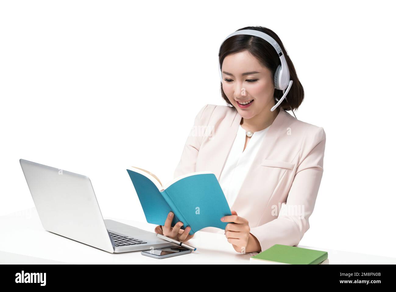 Young woman wearing a headset to use a computer Stock Photo - Alamy