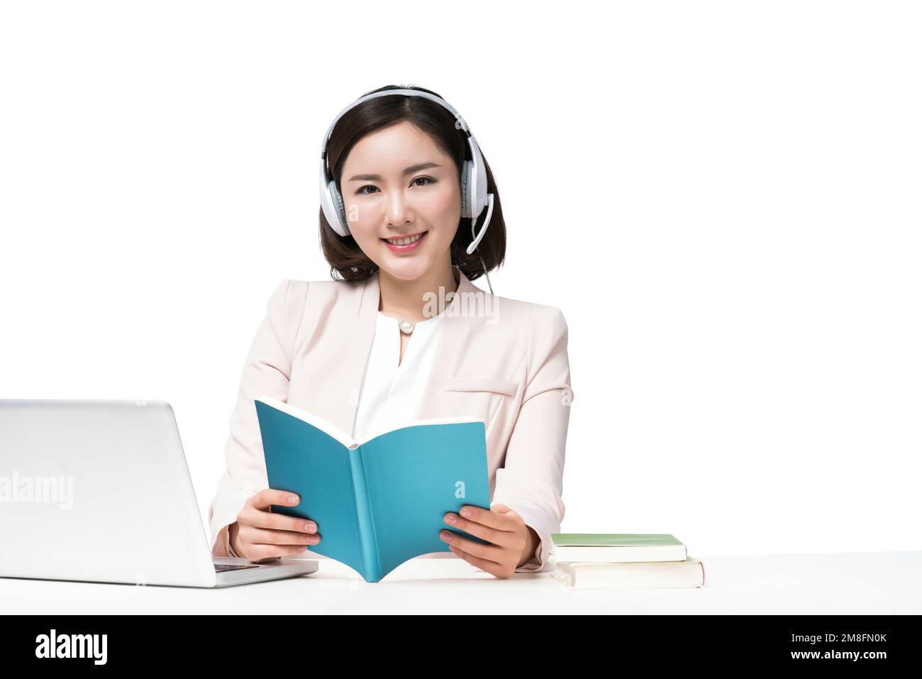 Young woman wearing a headset to use a computer Stock Photo - Alamy