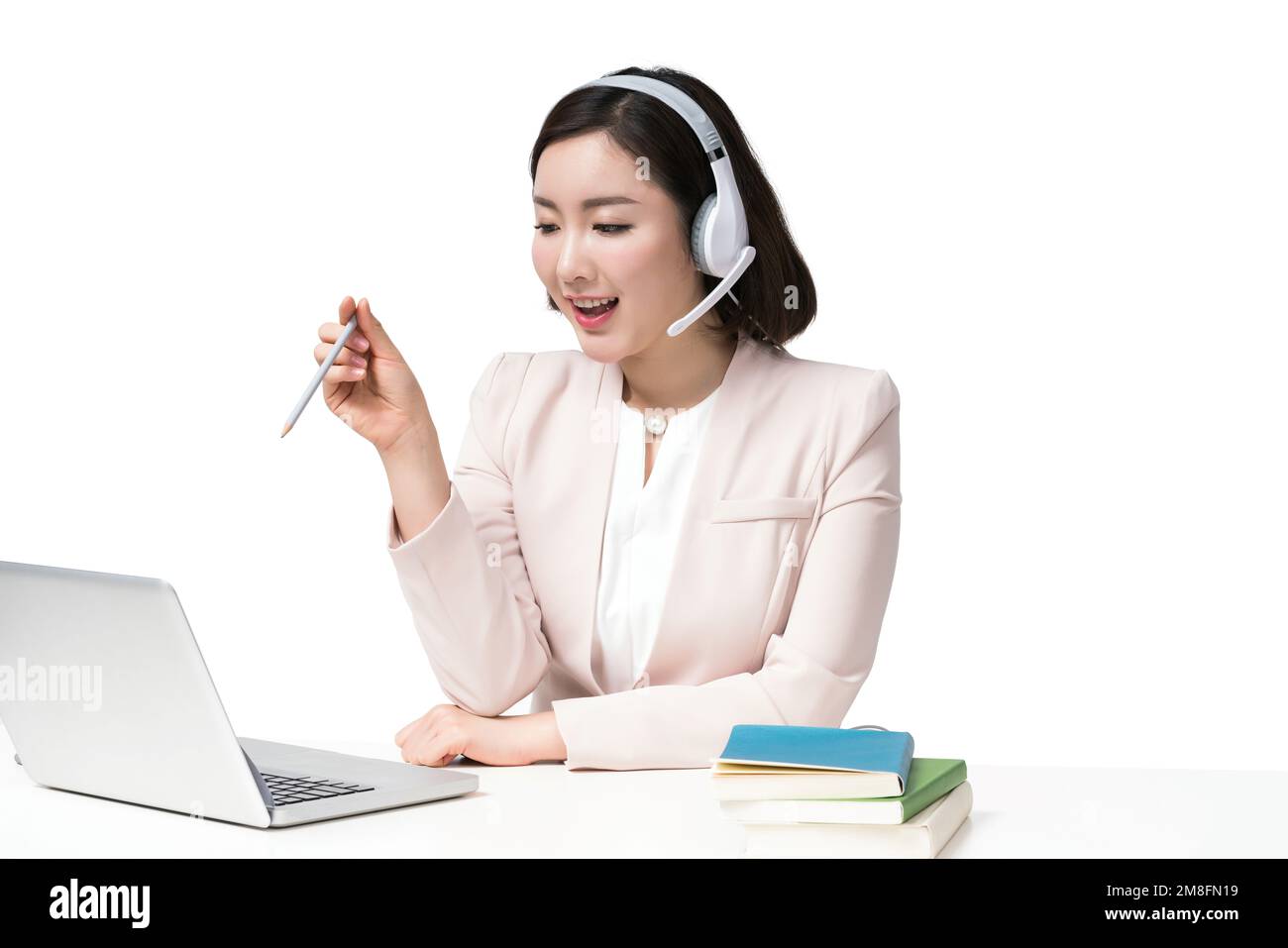 Young woman wearing a headset to use a computer Stock Photo - Alamy