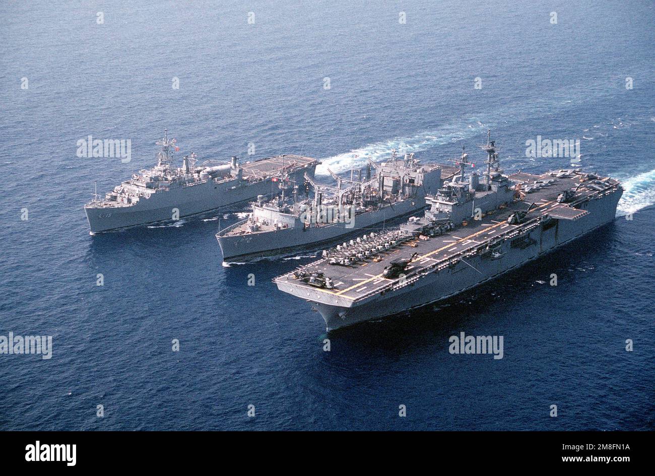 The amphibious transport dock USS PONCE (LPD 15), left, and the ...