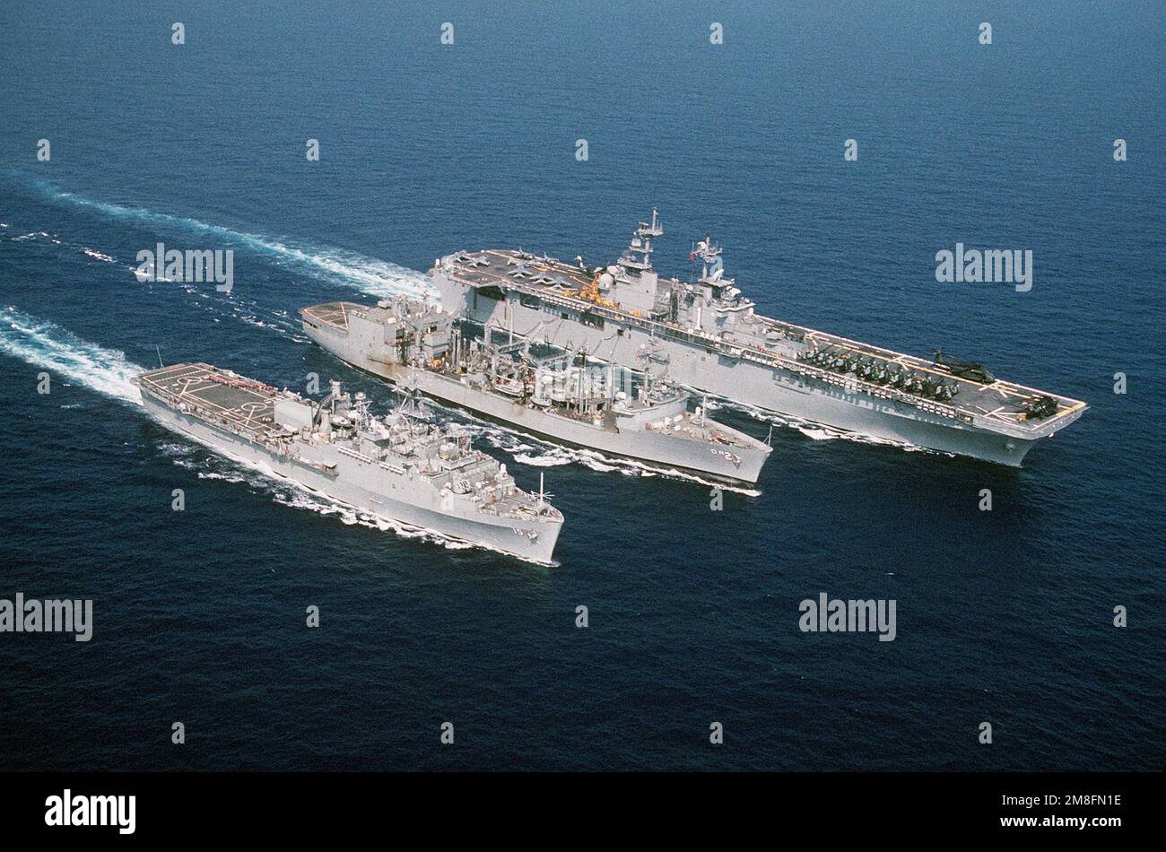 The replenishment oiler USS MILWAUKEE (AOR-2), center, conducts an ...