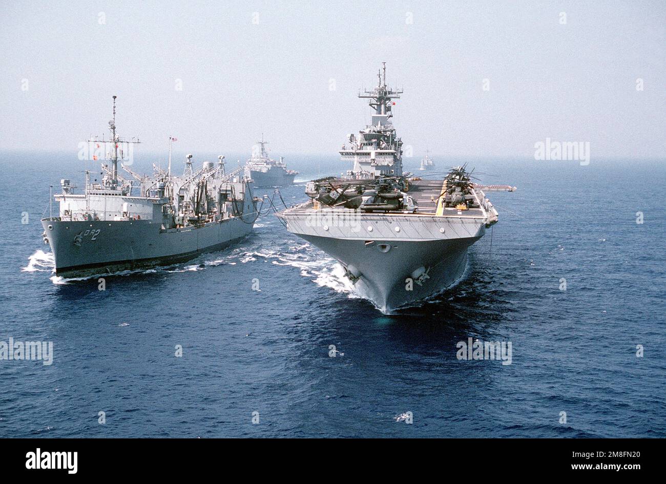 The replenishment oiler USS MILWAUKEE (AOR 2), left, conducts an ...