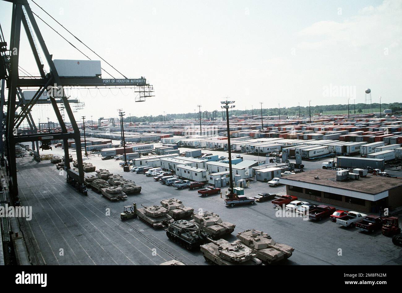 M-1A1 Abrams main battle tanks, M-88A1 armored recovery vehicles sit on ...