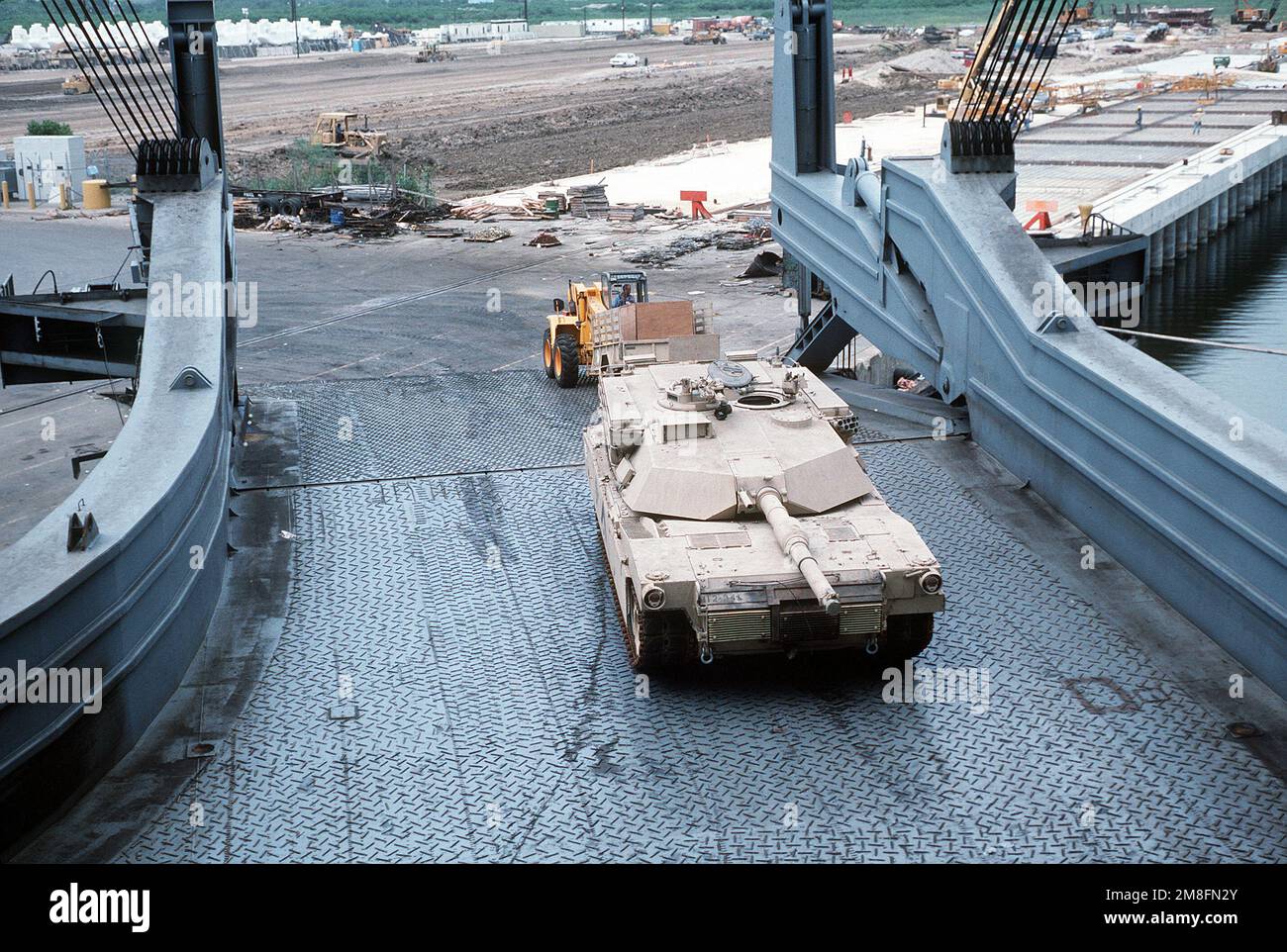 An M-1A1 Abrams main battle tank waits on the stern ramp of the ...