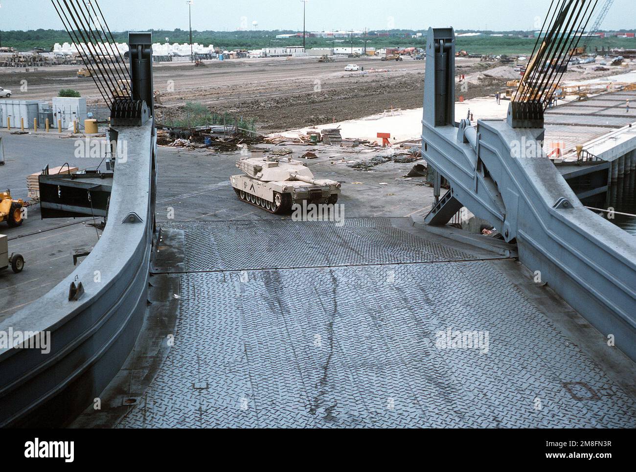 An M-1A1 Abrams main battle tank waits on the stern ramp of the ...
