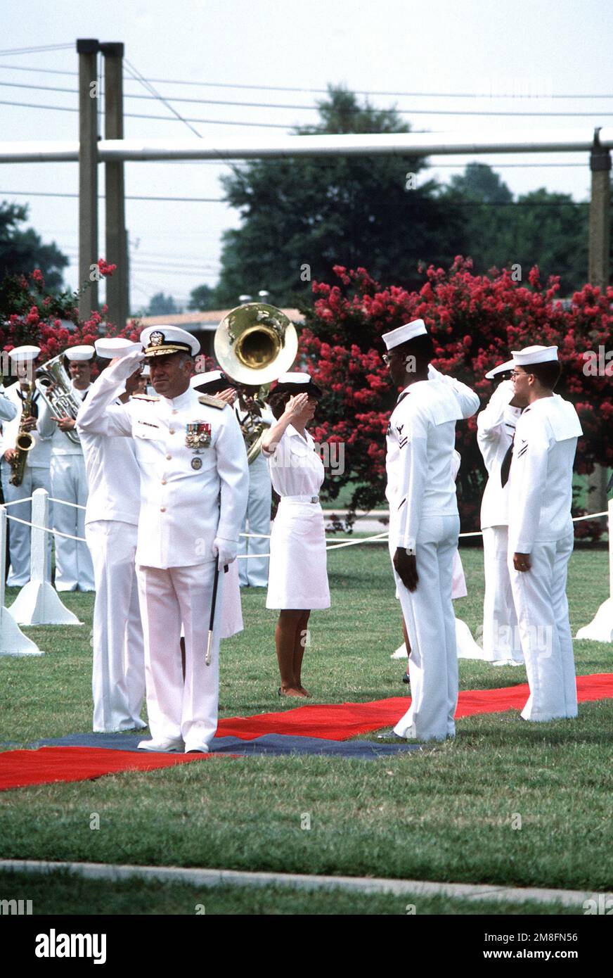 Sideboys salute as ADM Frank B. Kelso II, chief of naval operations ...