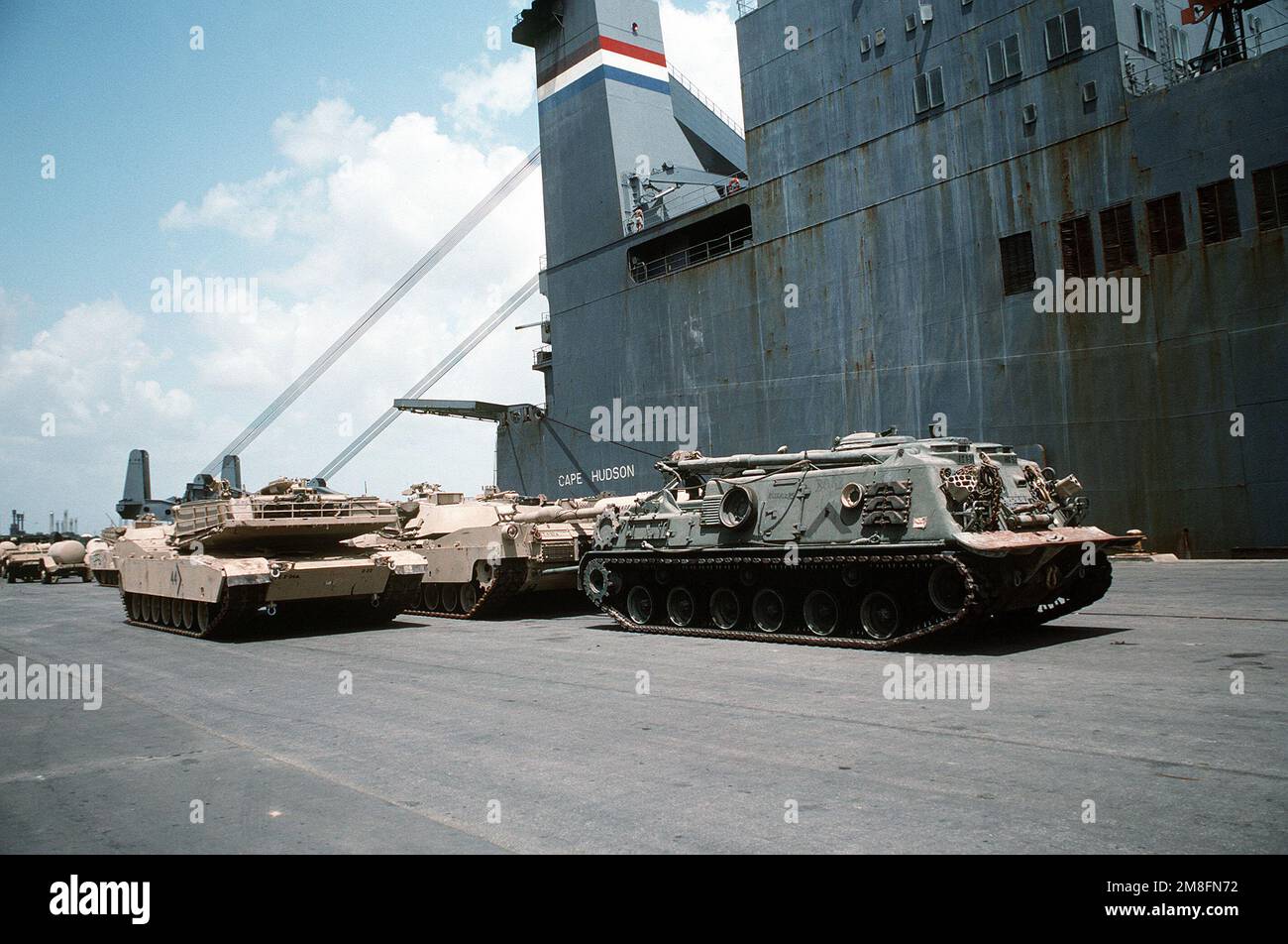 An M-88A1 armored recovery vehicle, right, and two M-1A1 Abrams main ...