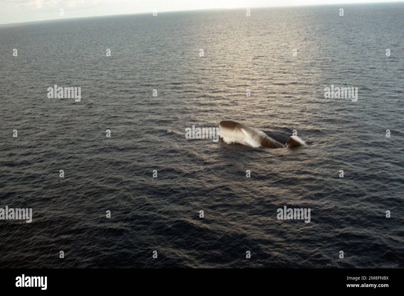 The nuclear-powered attack submarine USS ALEXANDRIA (SSN-757) surfaces ...